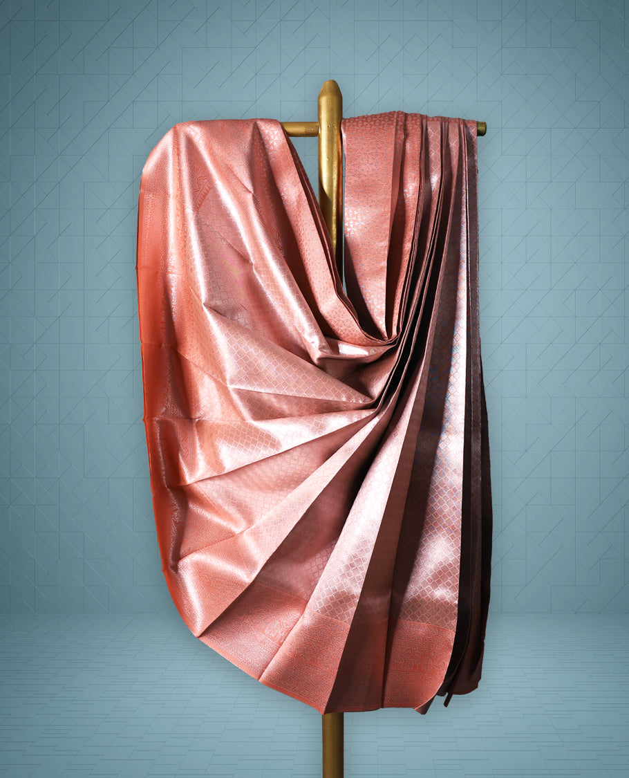 Peach colour Semi tissue saree featuring a brocade body, self coloured